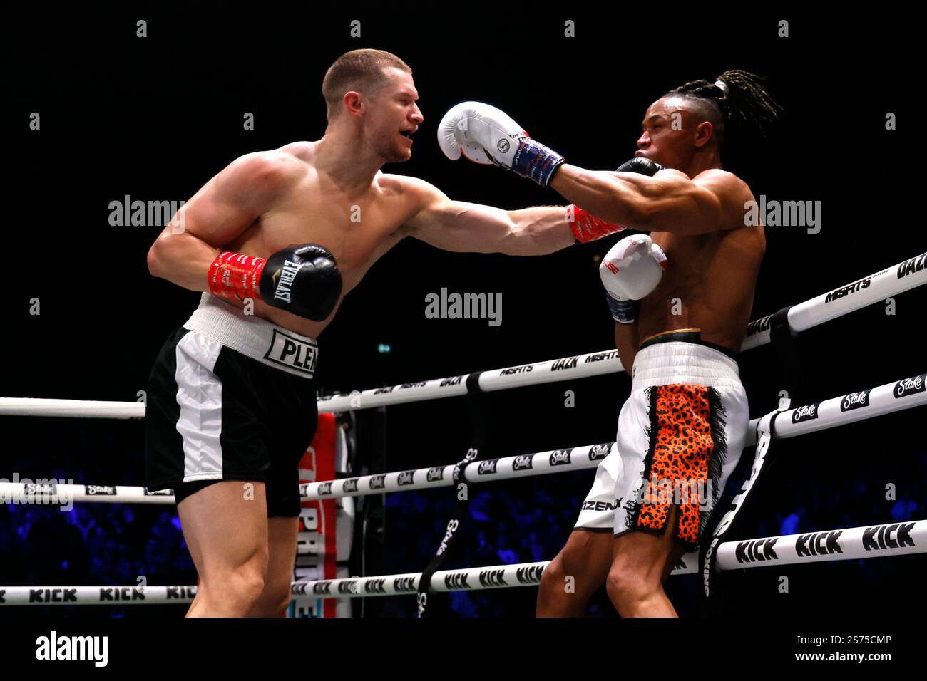 Wade Plemons (left) in action against Moziah Pinder in the light ...