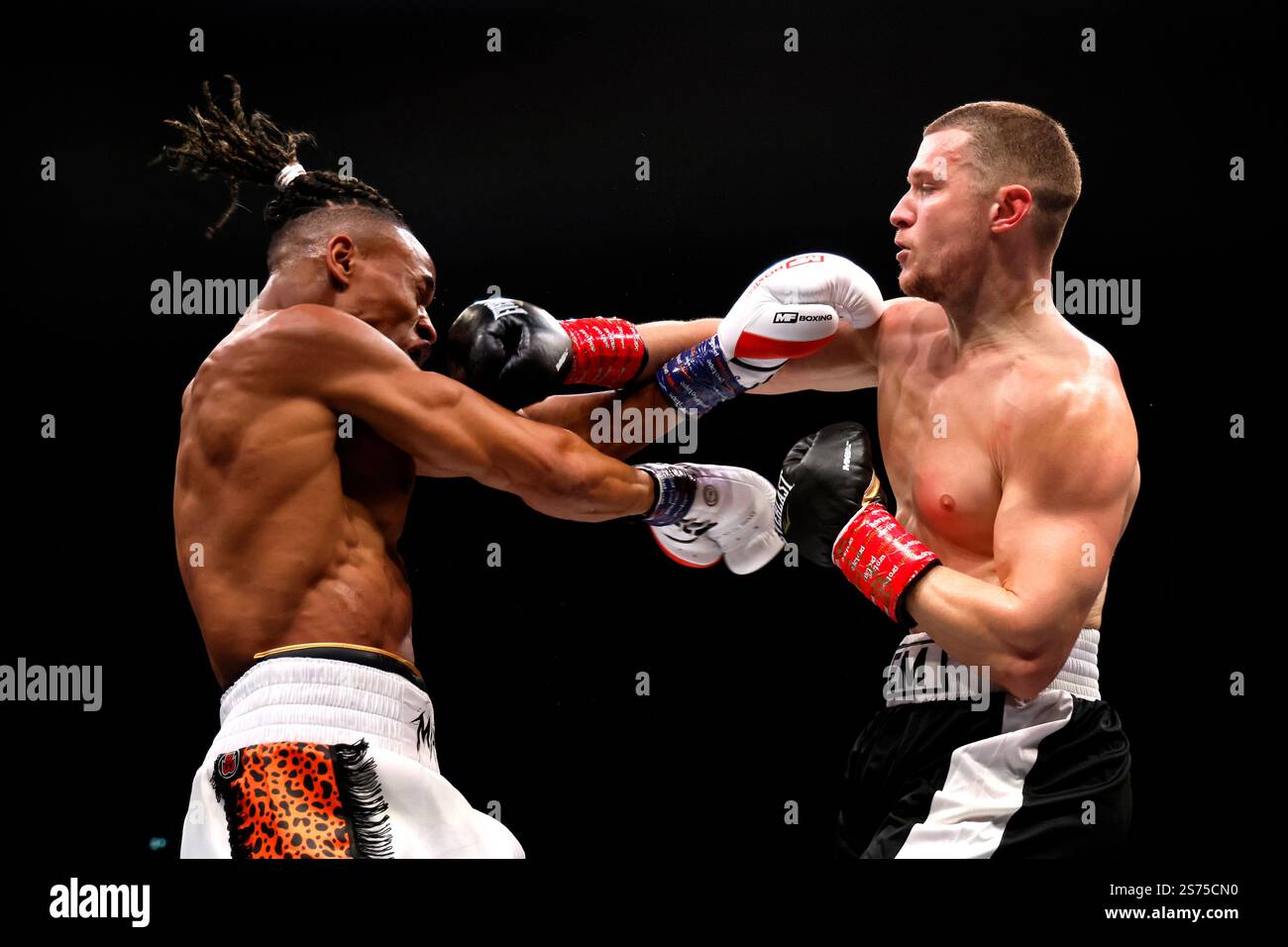 Wade Plemons (right) in action against Moziah Pinder in the light ...
