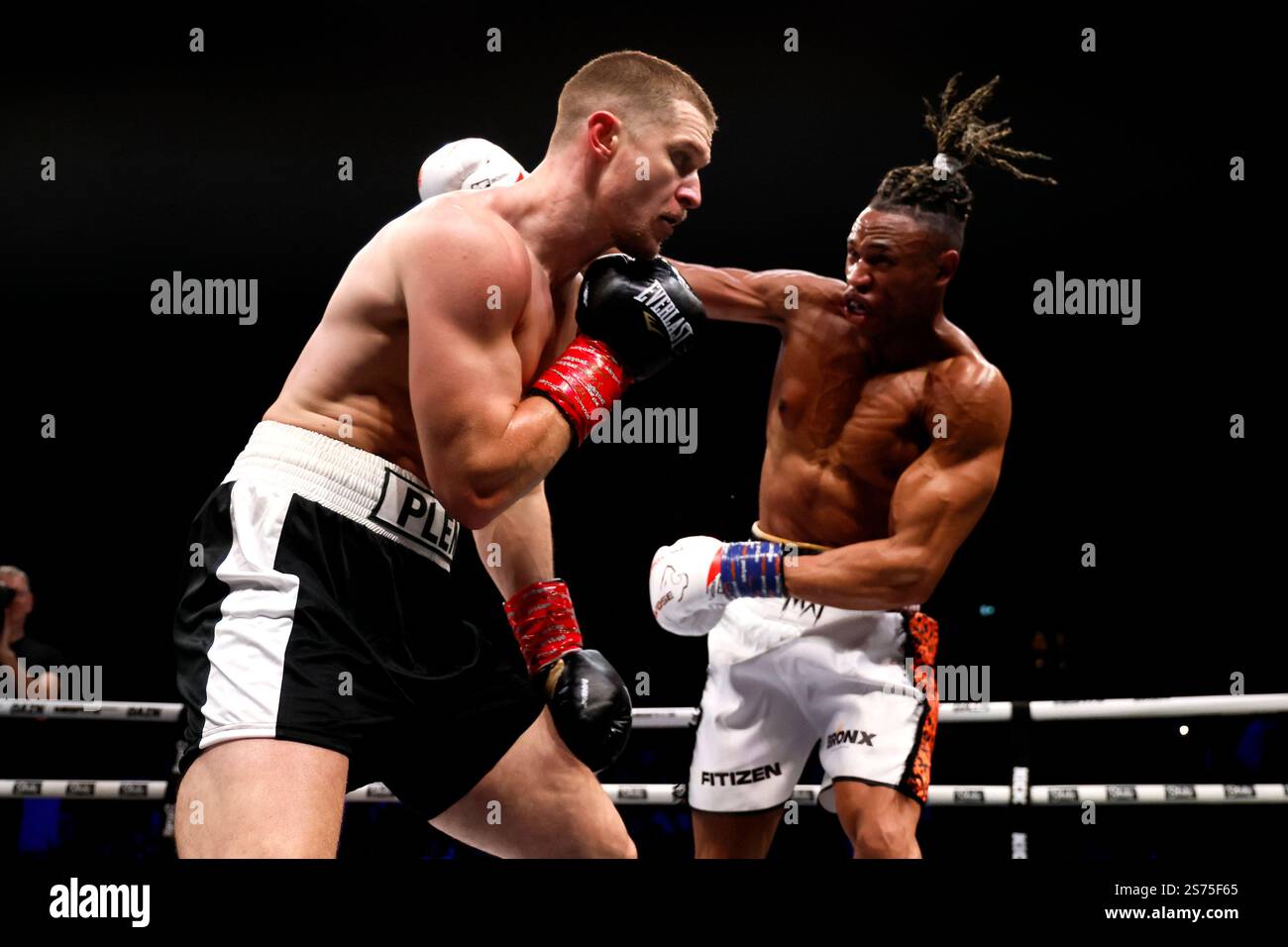 Moziah Pinder (right) in action against Wade Plemons in the light ...