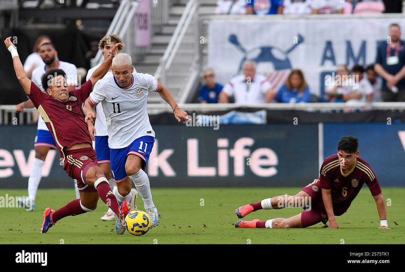 United States forward Matko Miljevic (11) tries to dribbles past ...
