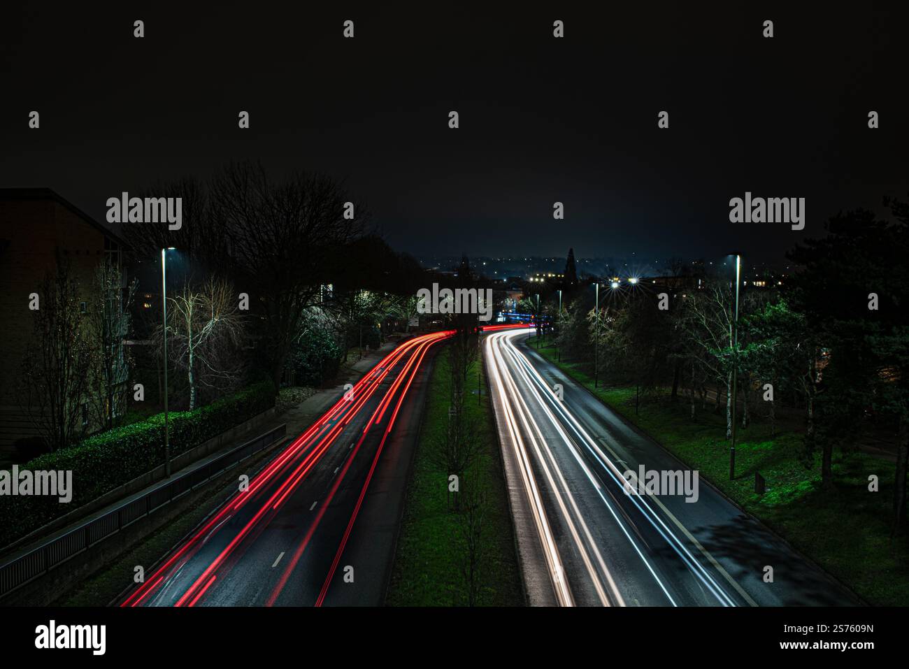 Long exposure view of cars light trails at night. Evening city traffic ...