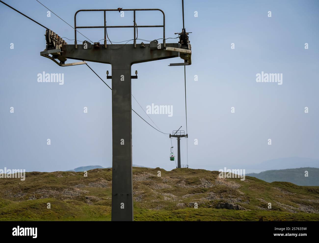 a passenger cable car gondola cabin travelling between pylons, opened ...