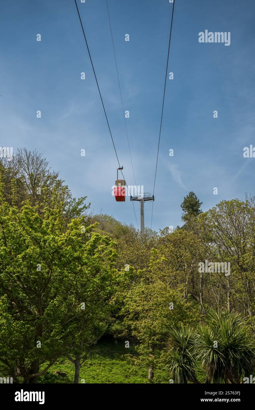a passenger cable car gondola cabin travelling between pylons, opened ...
