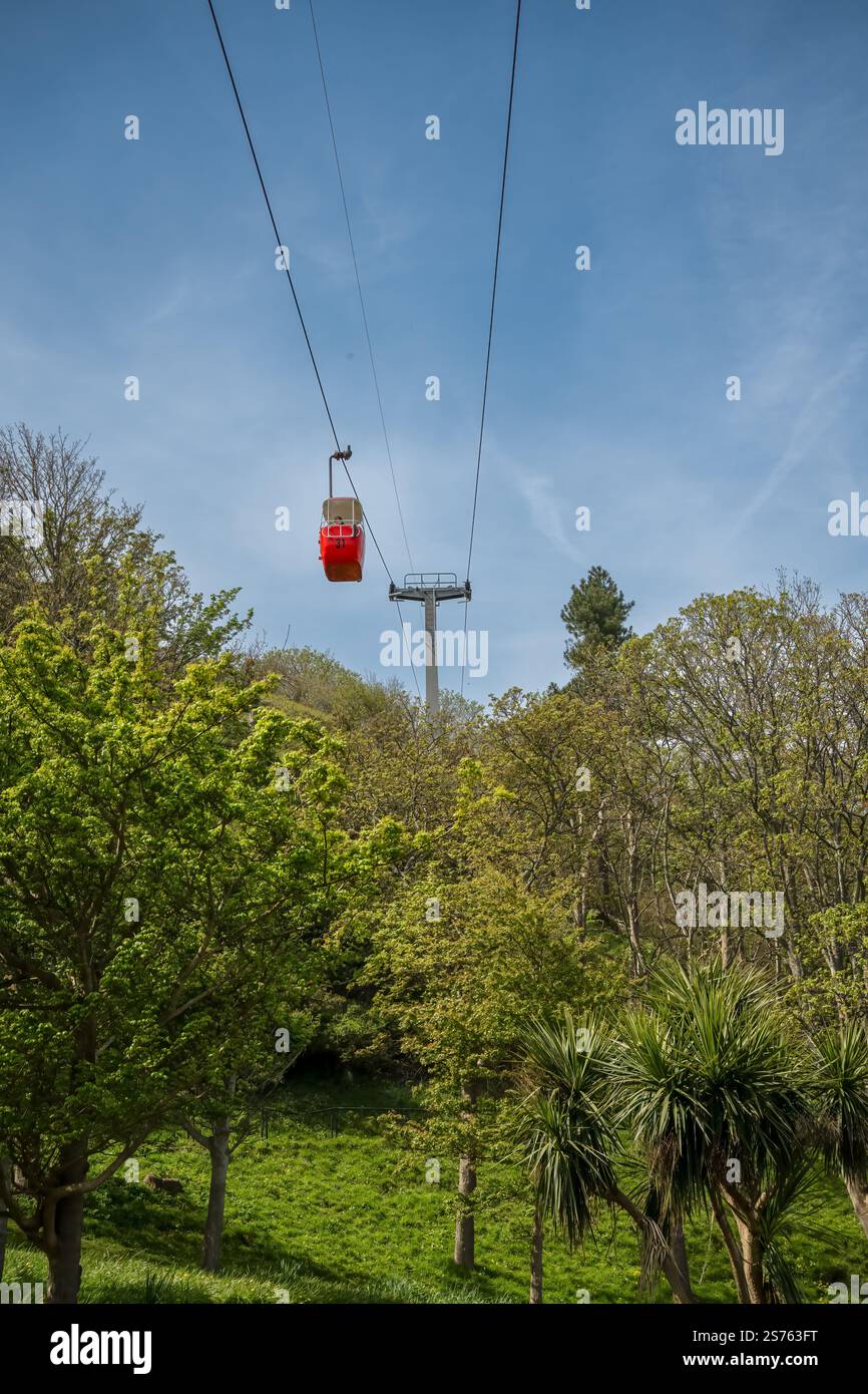 a passenger cable car gondola cabin travelling between pylons, opened ...