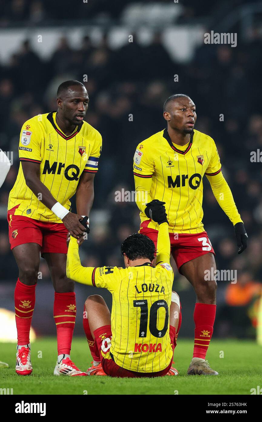 Watford’s Moussa Sissoko and Watford’s Edo Kayembe help team mate ...