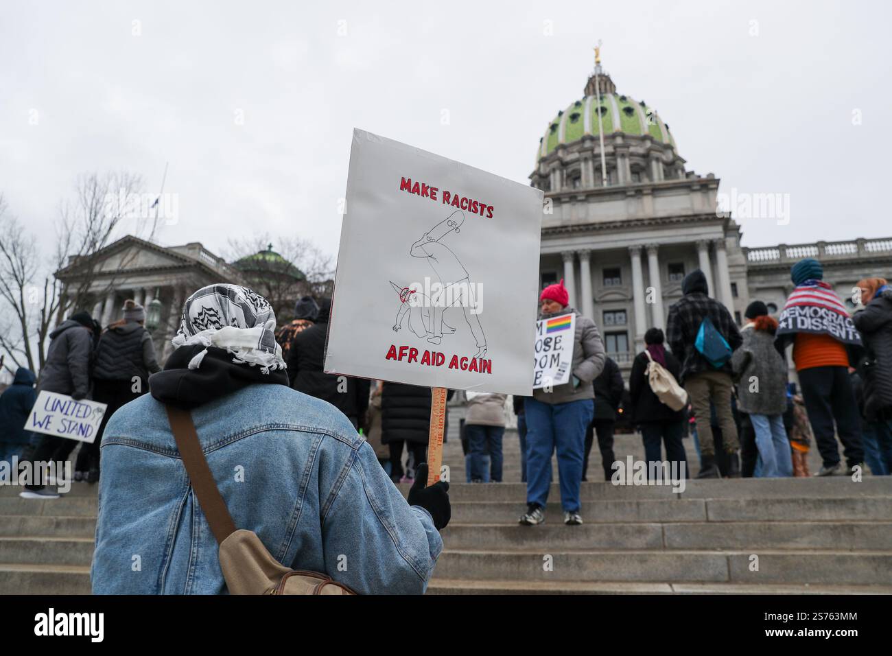 Harrisburg, United States. 18th Jan, 2025. A protester holds a sign ...