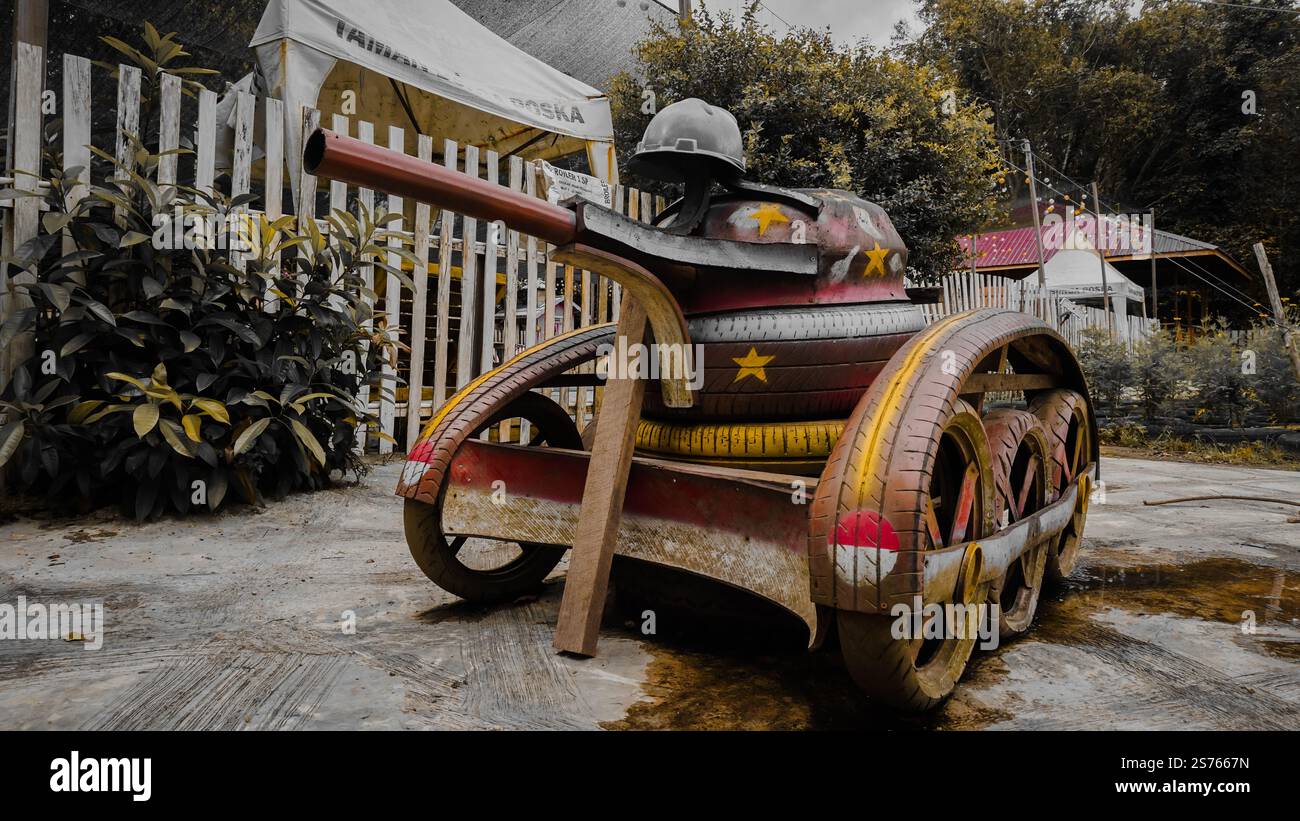 A colorful, handmade tank sculpture made from recycled materials ...