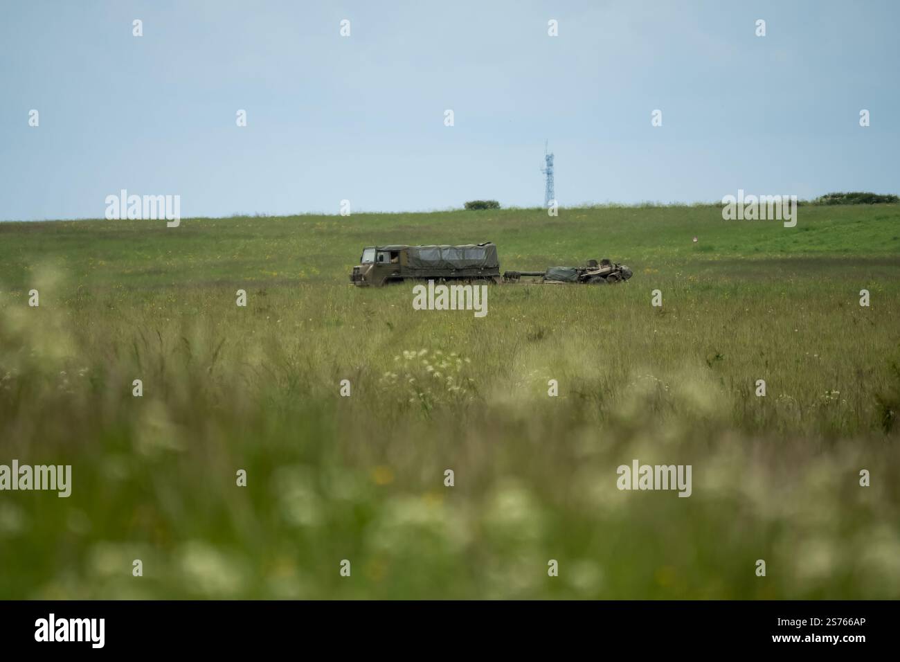 Pinzgauer 6x6 utility vehicle towing a 105mm Light Artillery Gun on a ...