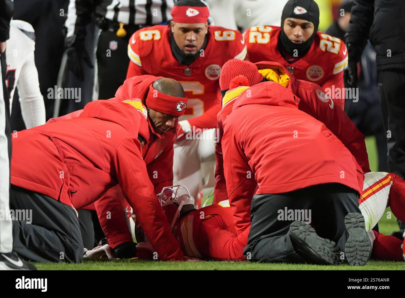 Kansas City Chiefs safety Justin Reid is checked on after being injured ...