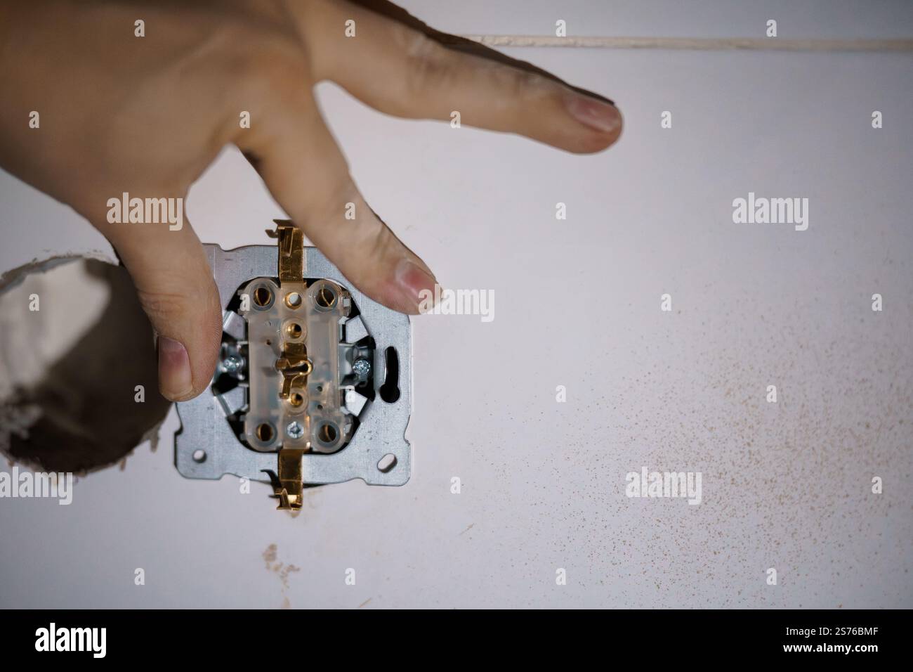 Hand Installing Electrical Outlet in Wall Stock Photo - Alamy