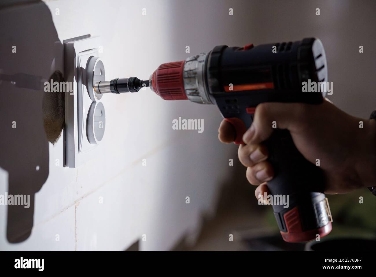 Hand Using Electric Screwdriver to Install Wall Socket Stock Photo - Alamy