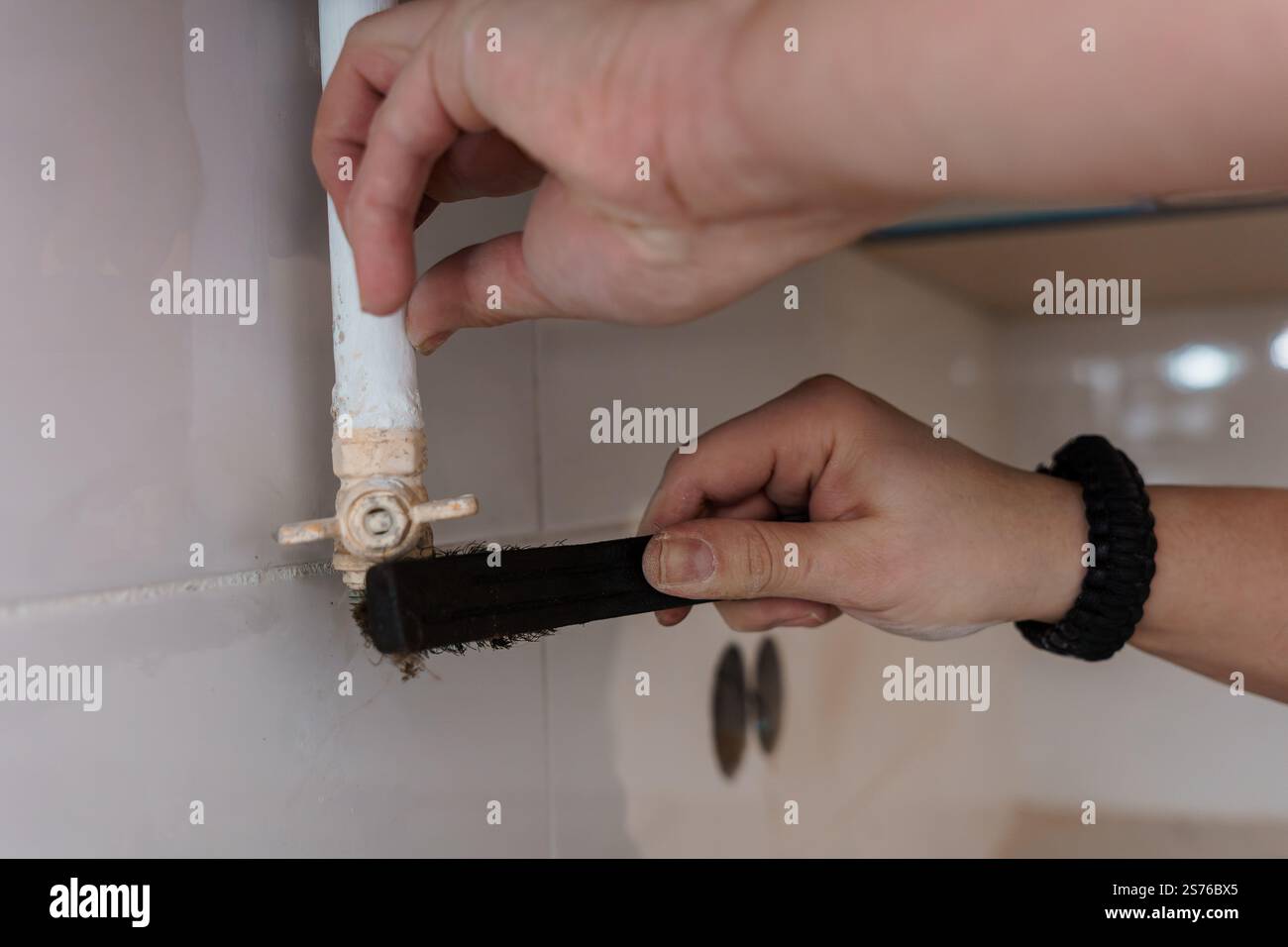 Plumbing Maintenance: Cleaning the Pipe Joint to Prevent Clogs Stock ...