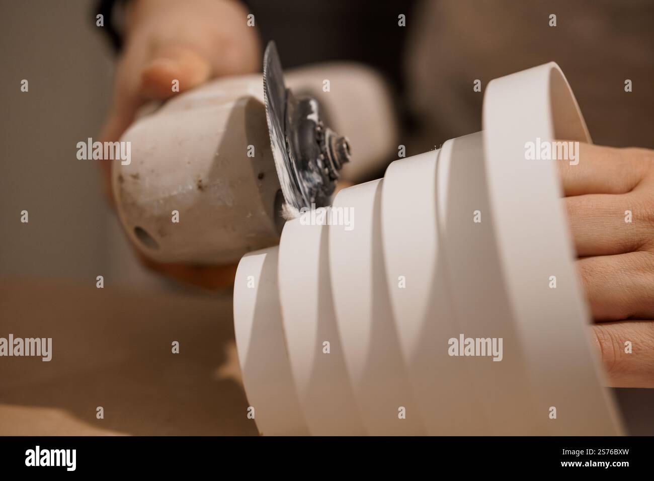 Precision Cutting of White Material Using Power Tool Stock Photo - Alamy