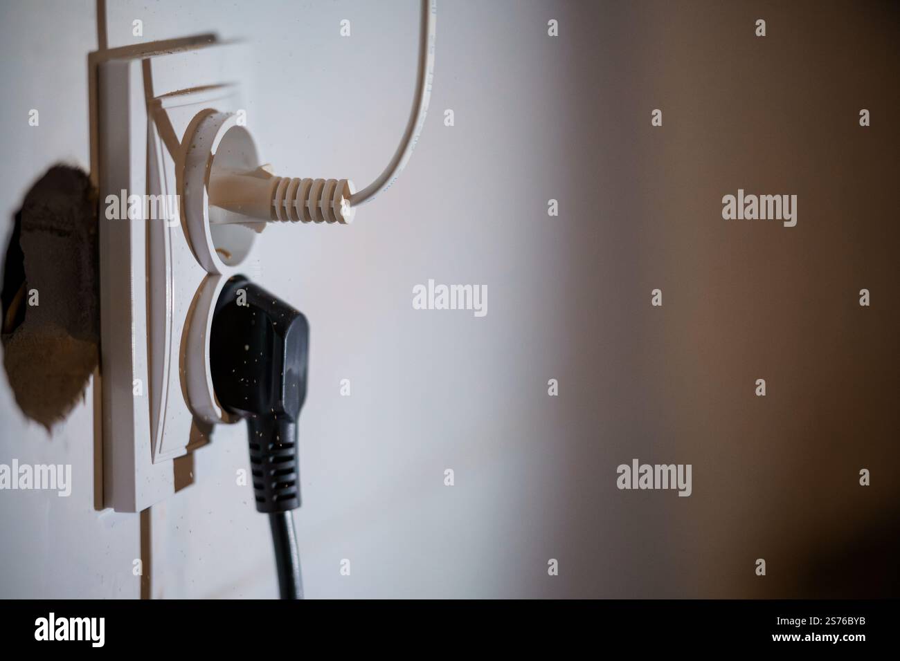 Power Outlet with Plugged-in Cords Stock Photo - Alamy