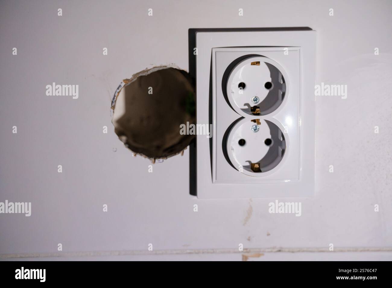 Wall Socket Installation with Exposed Wall Cavity Stock Photo - Alamy