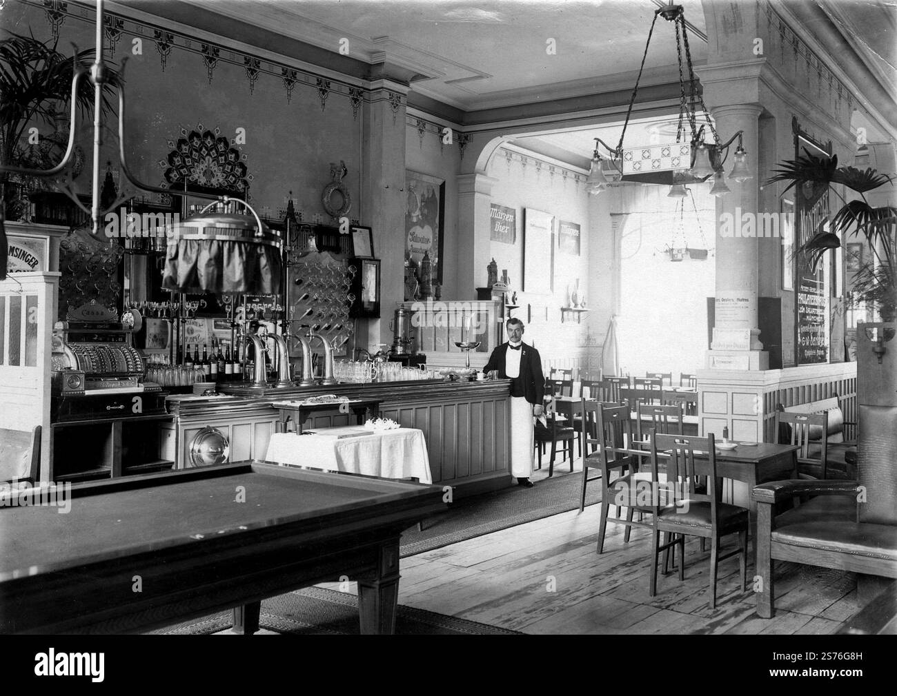 Interior with bar, waiter and billiards of the Bavaria café on the ...