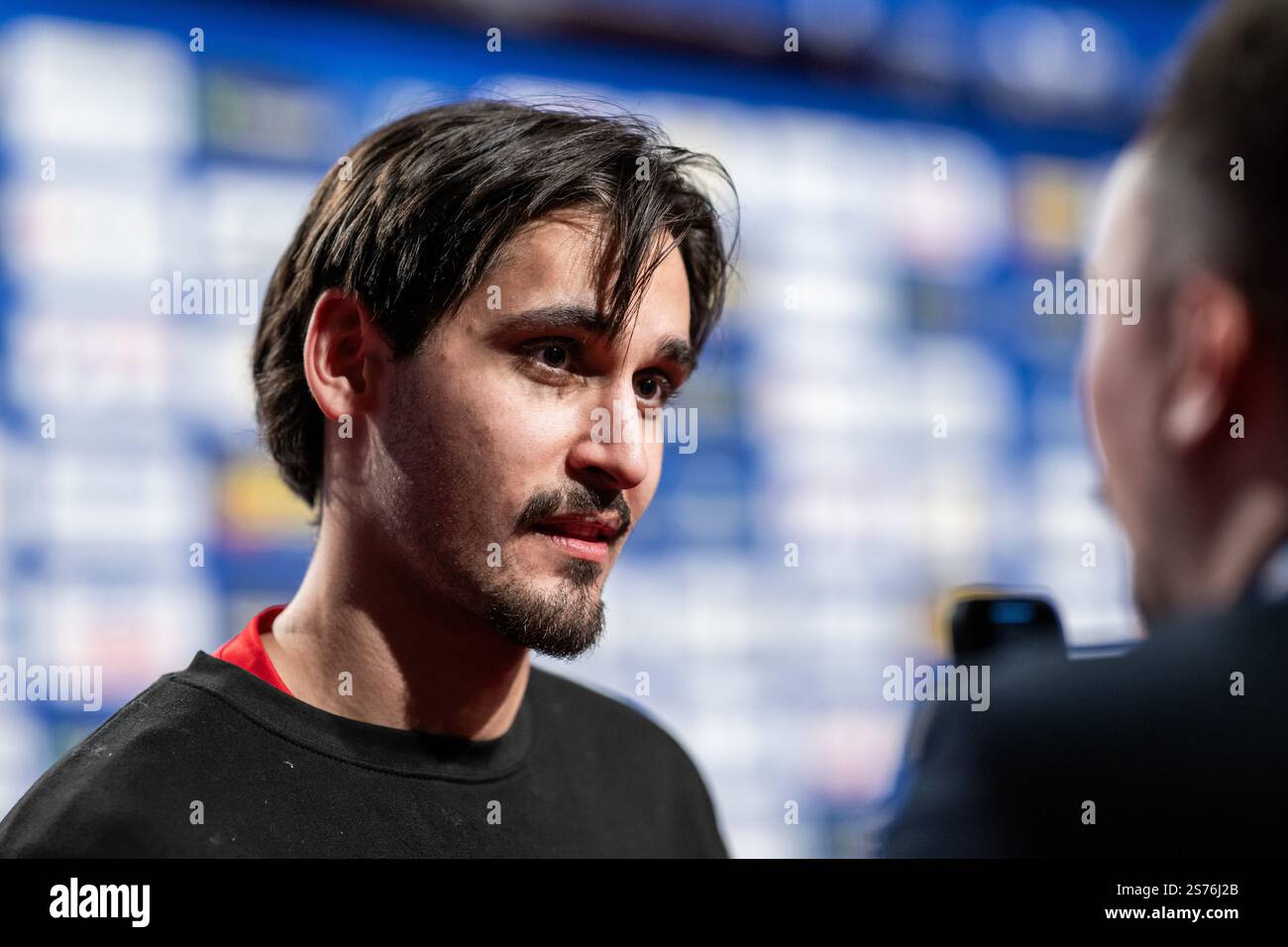 250118 Joshua Mesias of Chile is interviewed in the mixed zone after ...