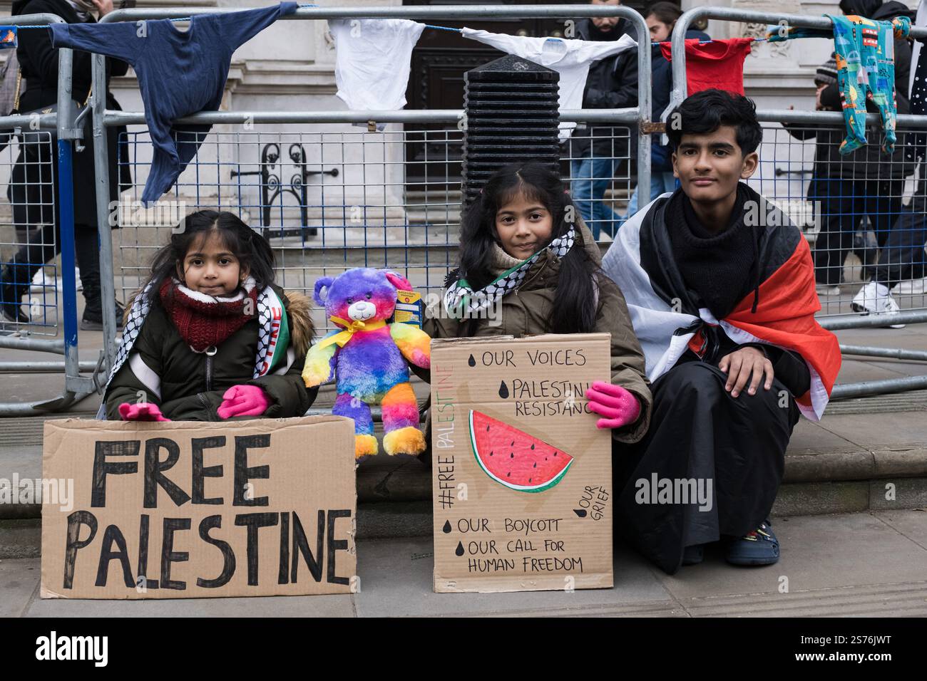 A group of young protestors Aizah, Aliza and Reza pose for a portrait ...