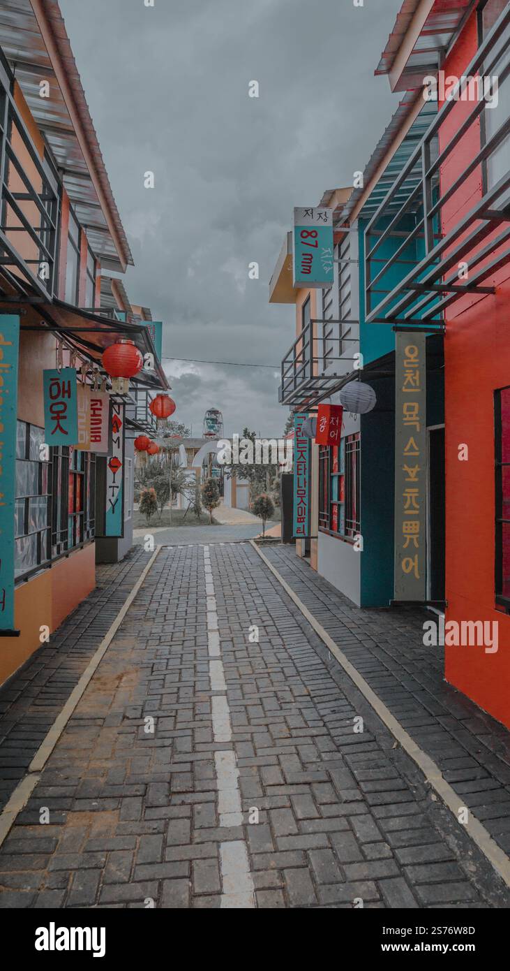 A colorful street scene featuring vibrant buildings with signs in ...