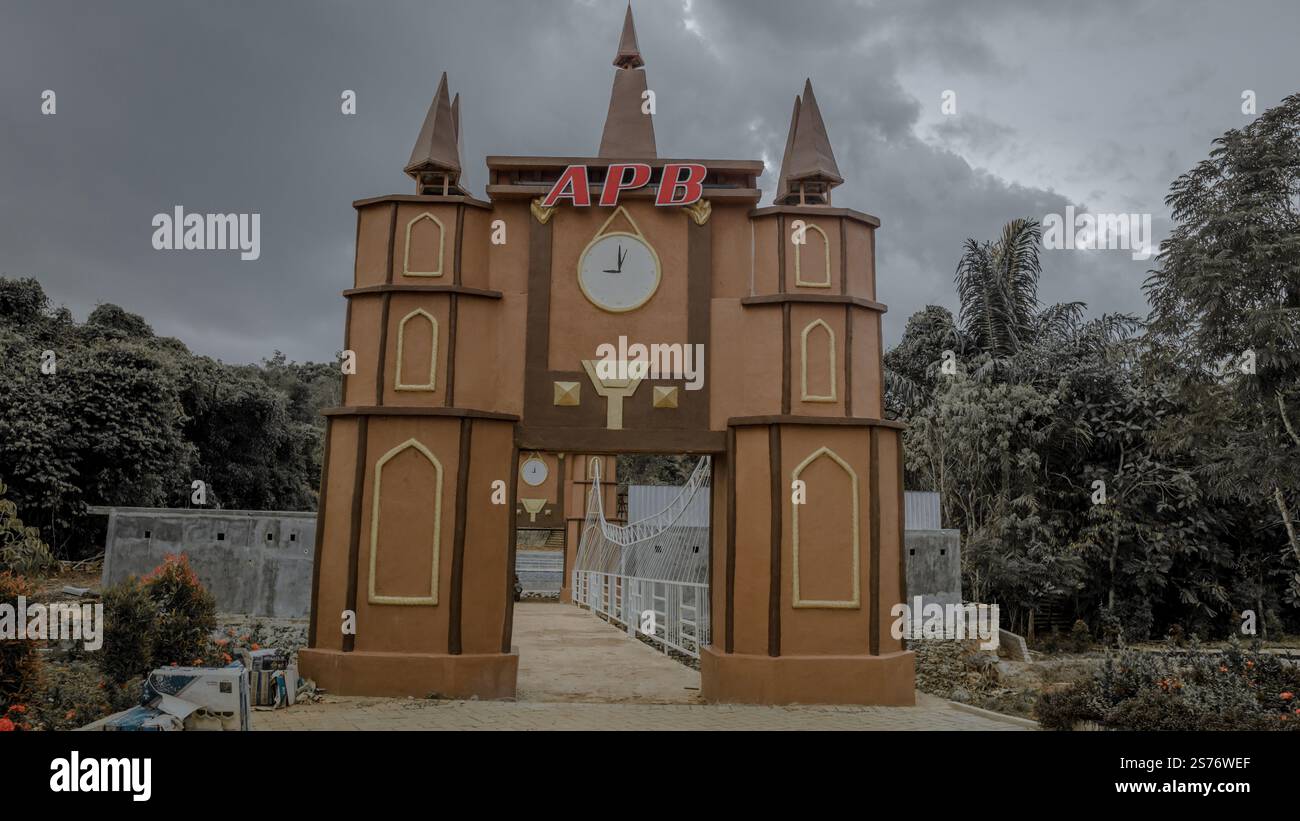 A large decorative entrance gate with towers, featuring a clock and the ...