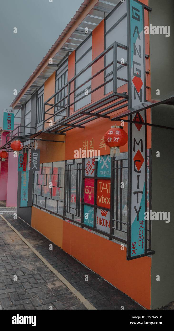 A street view of a building with colorful Korean and Japanese signs ...