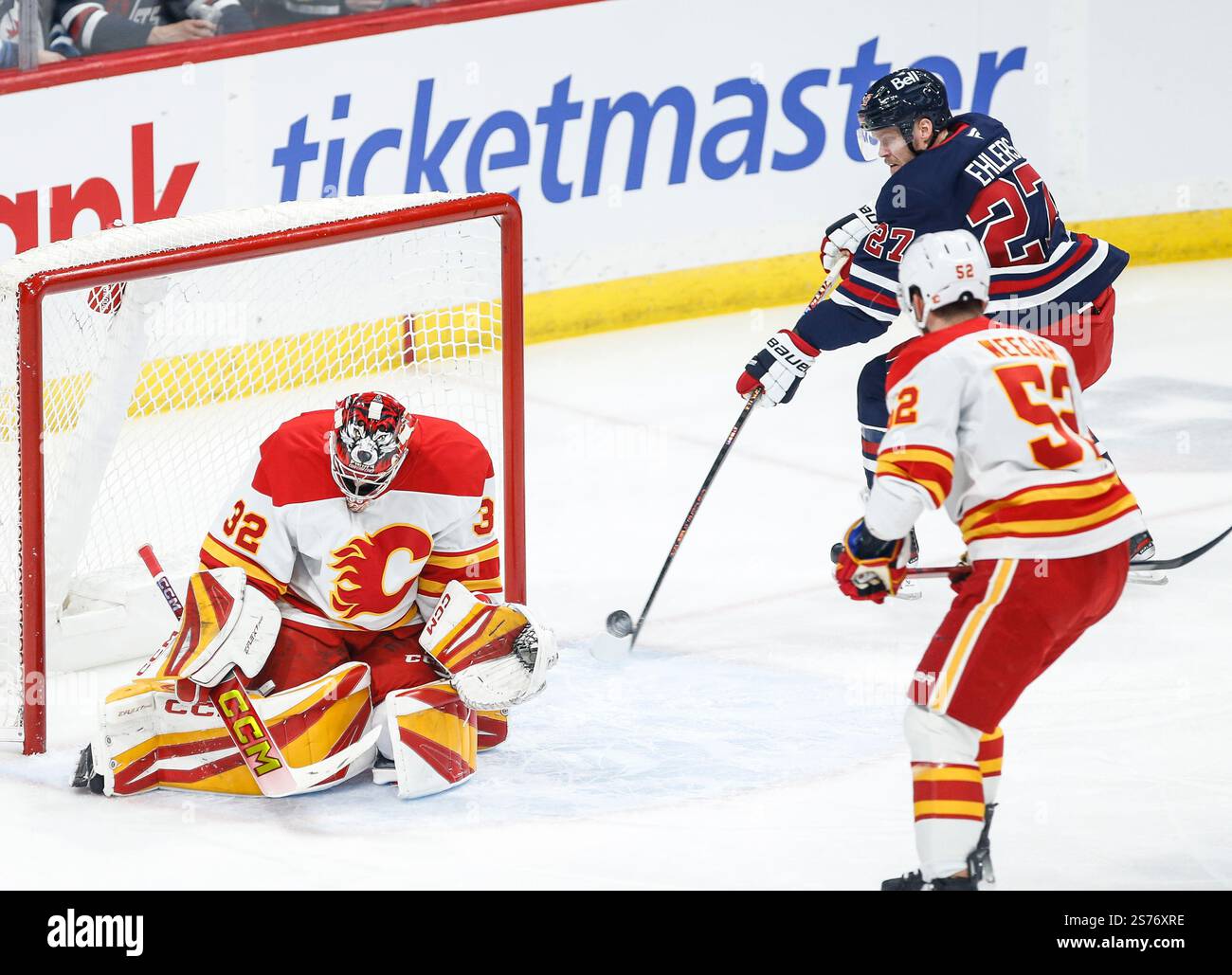 Winnipeg Jets' Nikolaj Ehlers (27) hits the post behind Calgary Flames ...