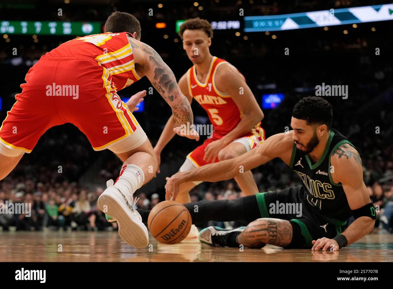 Atlanta Hawks' Garrison Mathews, left, and Boston Celtics' Jayson Tatum ...
