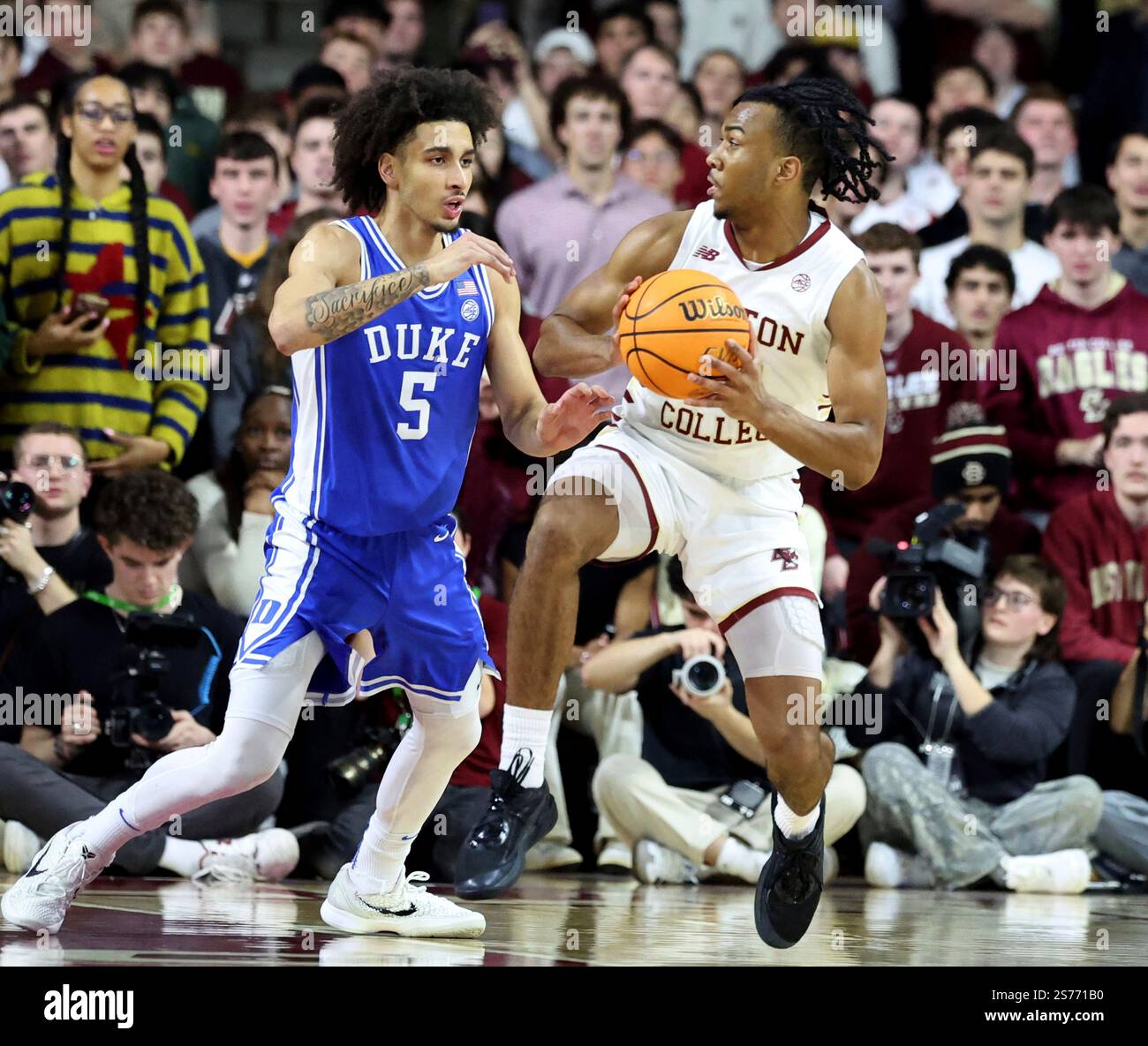 Boston College guard Donald Hand Jr. (13) defends the ball from Duke ...