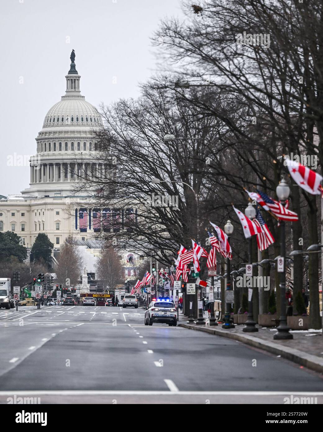 American flags decorate the road leading to the Capitol Building as ...