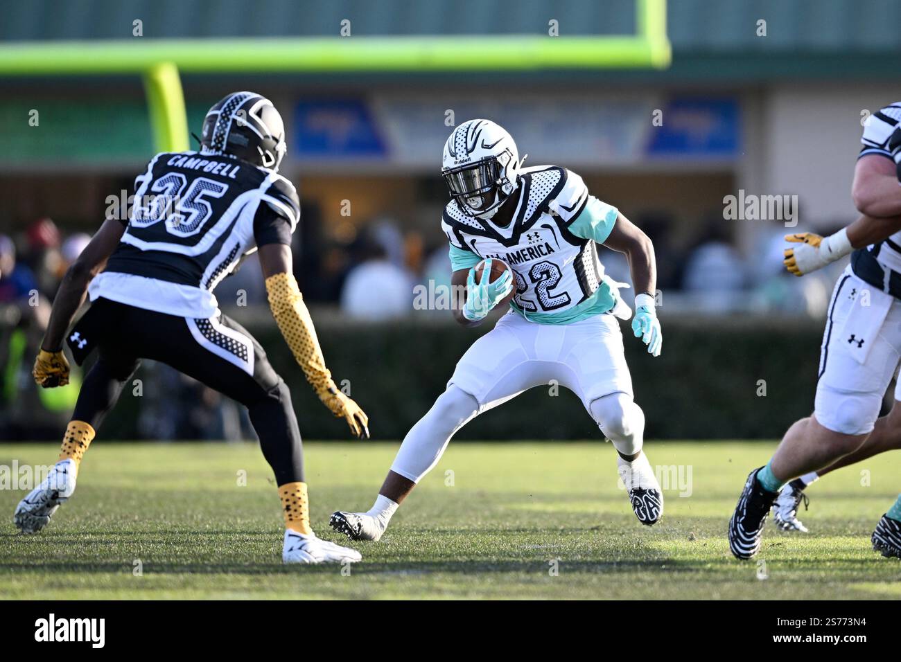 Team Unstoppable running back Byron Louis (22) rushes for yardage in ...