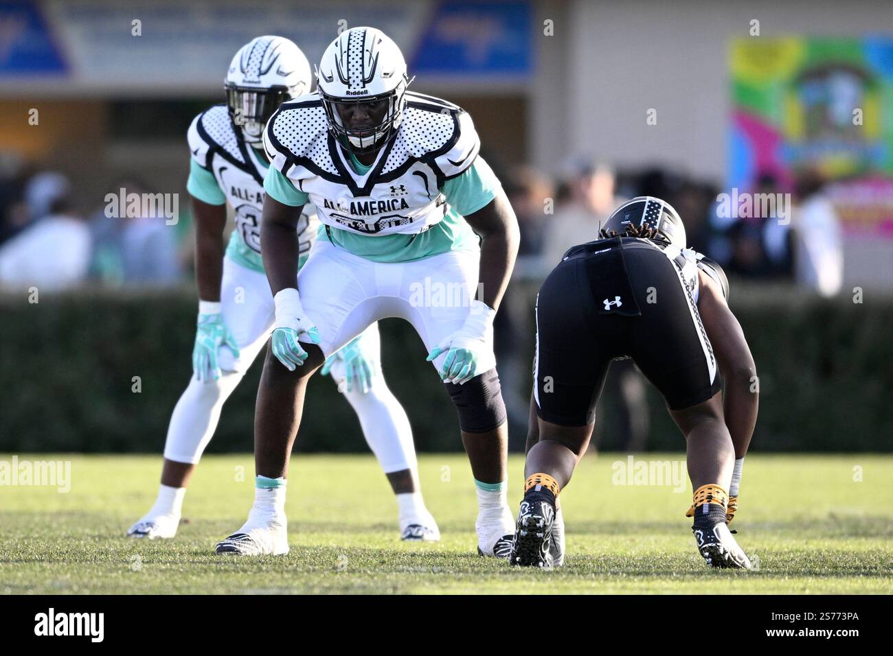 Team Unstoppable offensive lineman Michael Fasusi, left, sets up for a ...