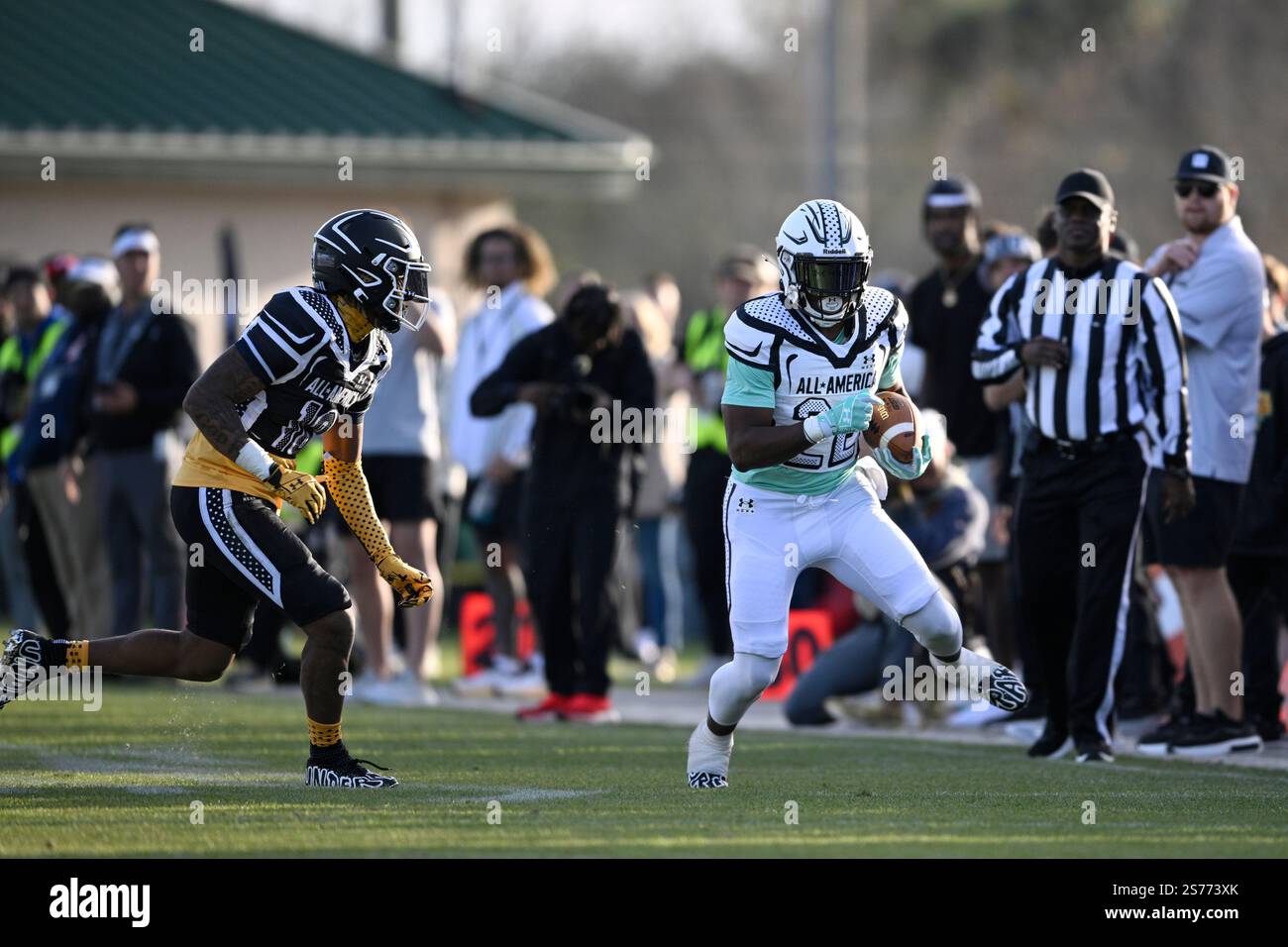 Team Unstoppable running back Byron Louis (22) rushes for yardage in ...