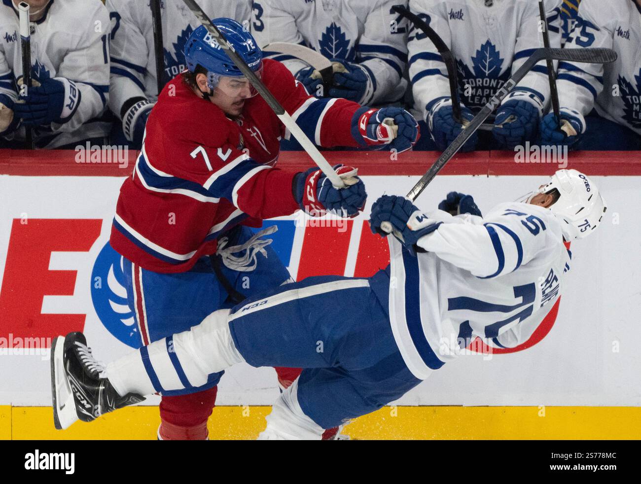 Montreal Canadiens' Arber Xhekaj (72) checks Toronto Maple Leafs' Ryan ...