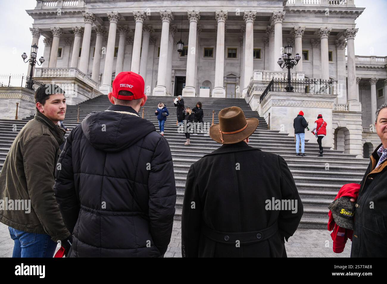 People wearing merchandise in support of President-elect Donald Trump ...