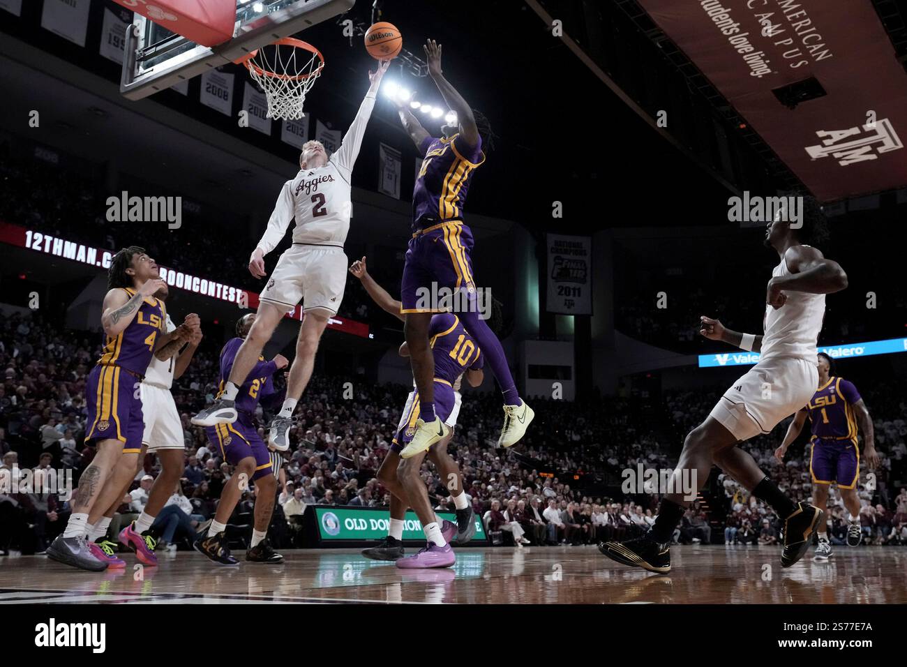 Texas A&M guard Hayden Hefner (2) grabs a rebound over LSU forward ...