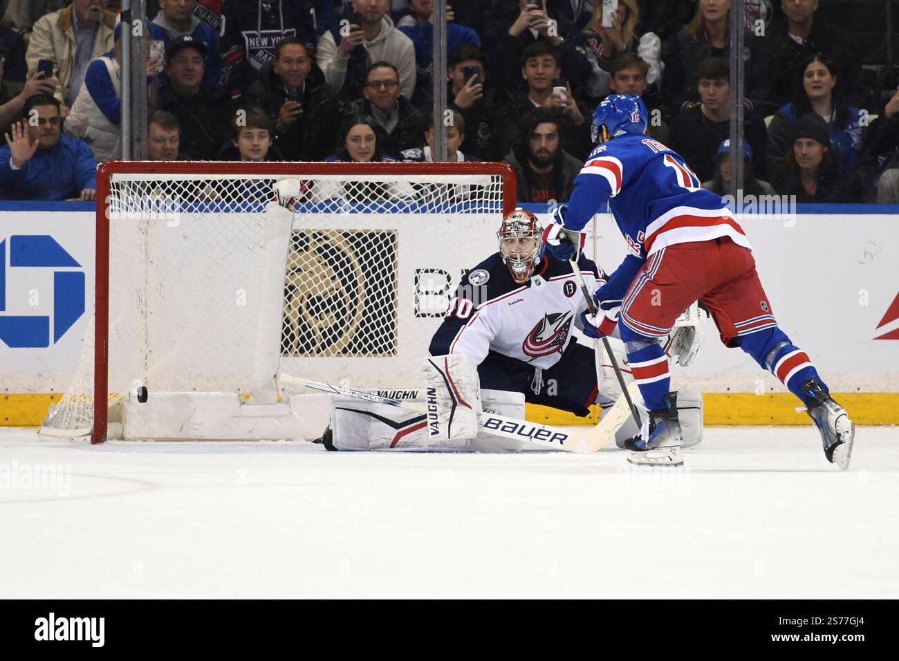 New York Rangers' Vincent Trocheck, right, scores a goal past Columbus ...
