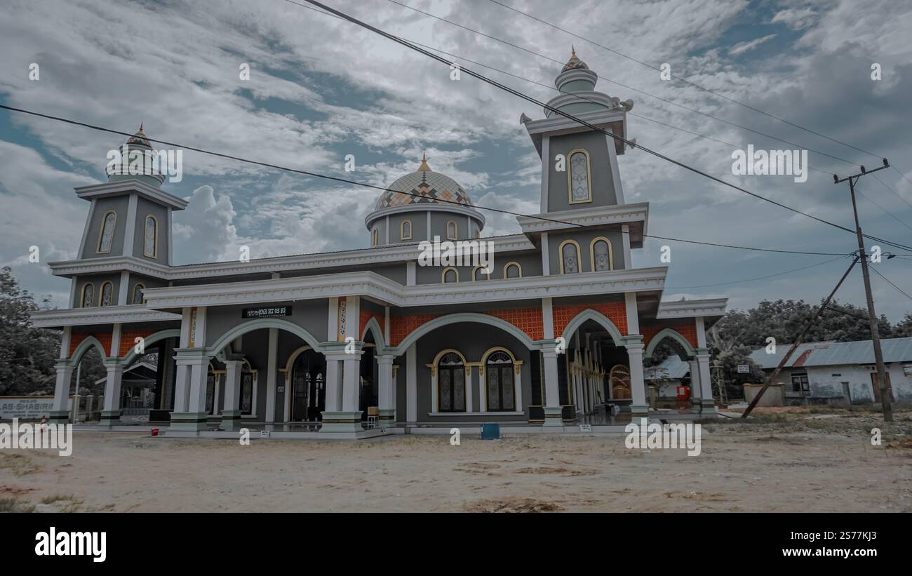 A modern mosque with intricate architectural details, featuring domes ...