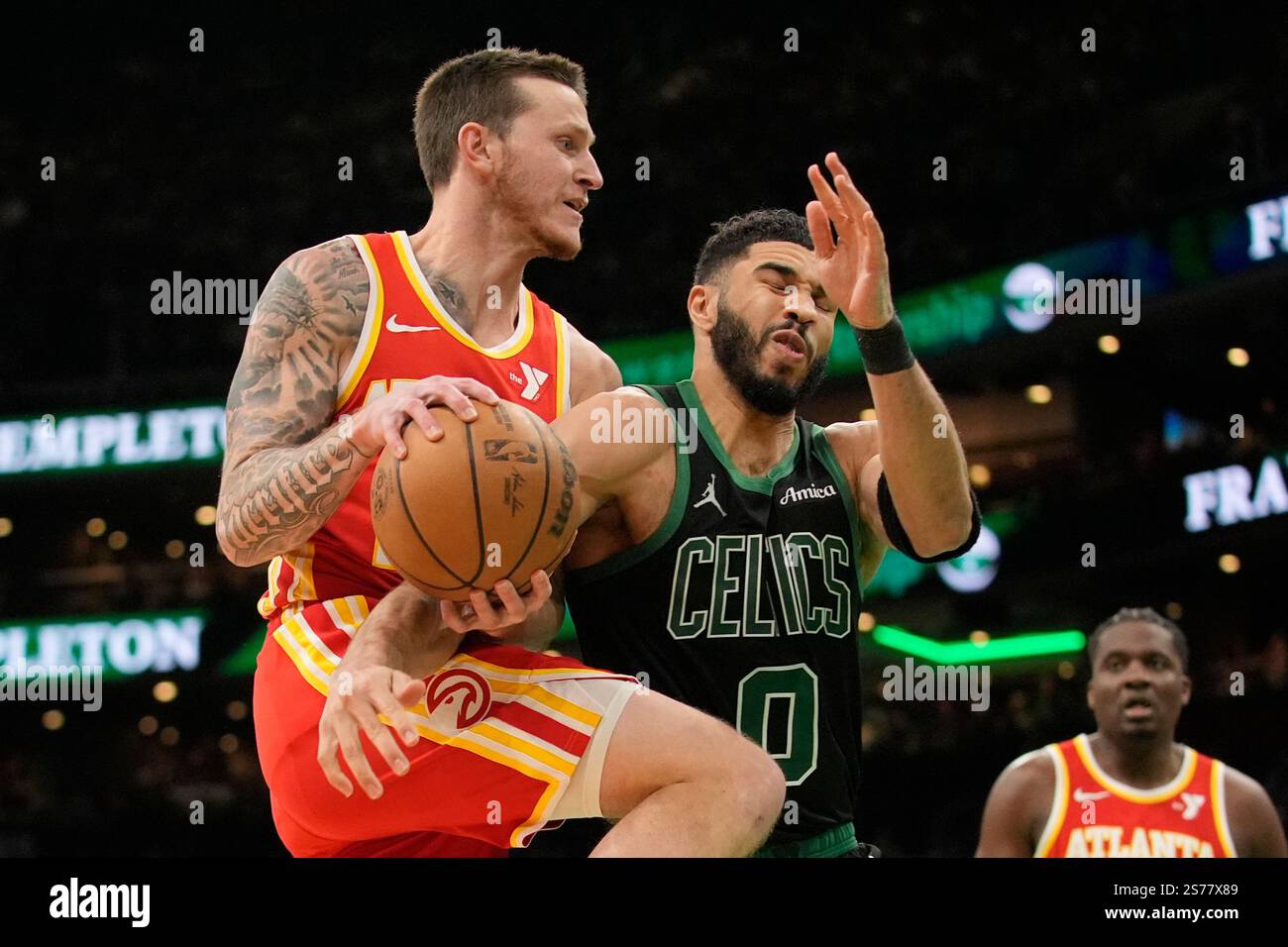 Atlanta Hawks' Garrison Mathews (24) is fouled by Boston Celtics ...