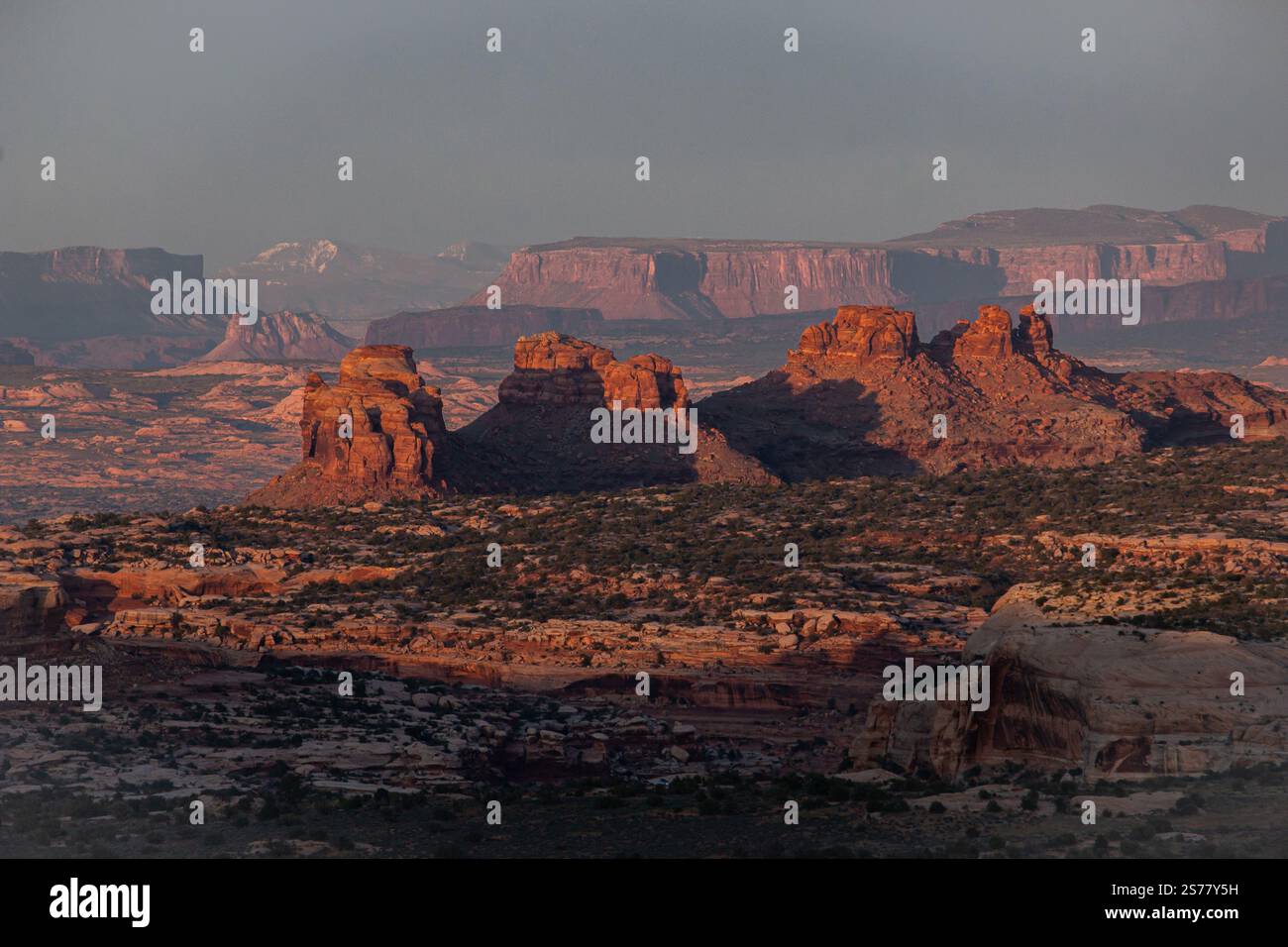 Red rocks in Utah glow under the golden hour light, showcasing dramatic ...