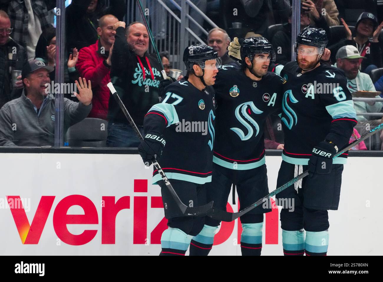 Seattle Kraken center Jaden Schwartz, left, celebrates his goal with ...