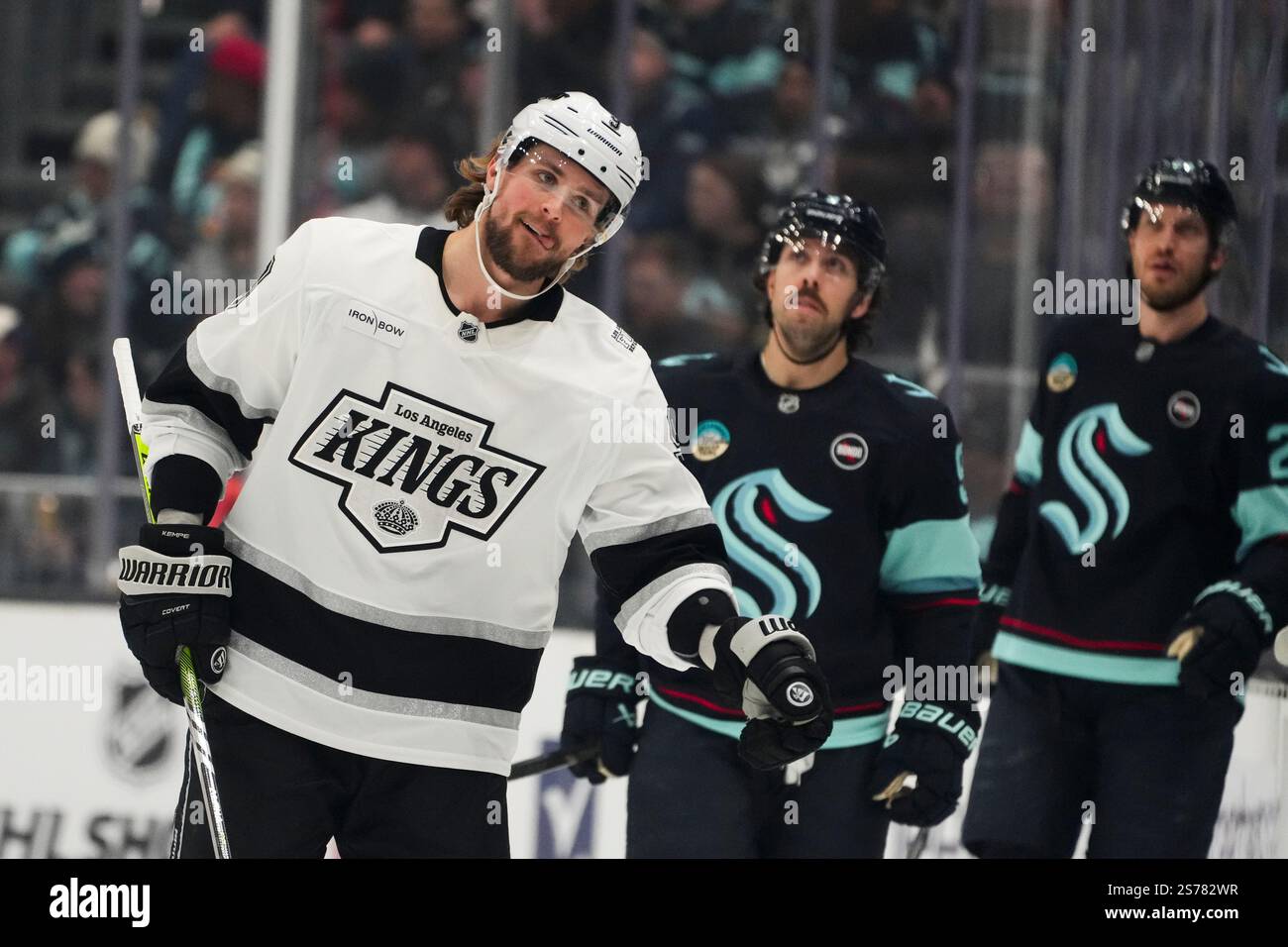 Los Angeles Kings right wing Adrian Kempe skates to the bench to ...