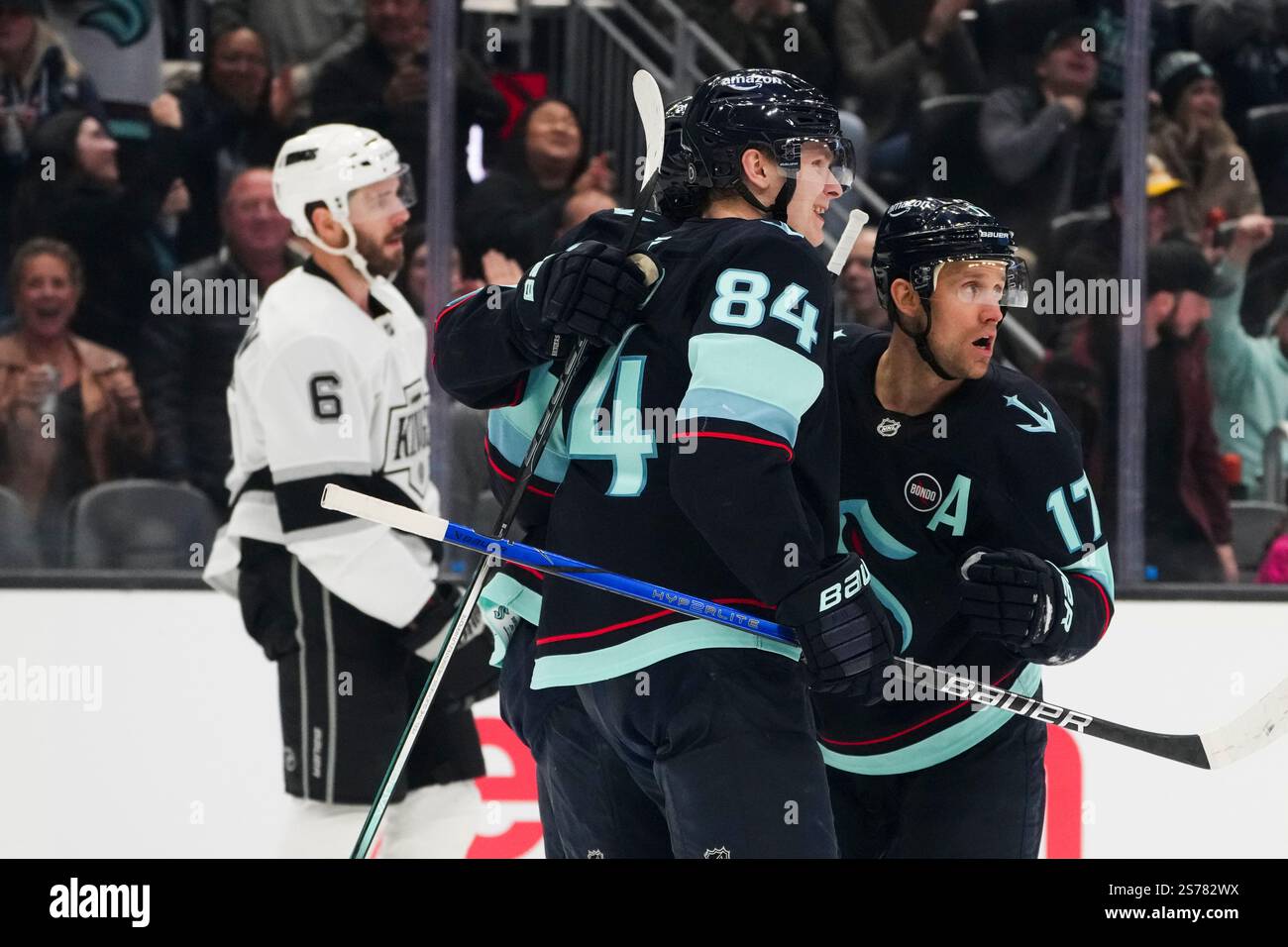 Seattle Kraken center Jaden Schwartz, right, celebrates his goal with ...
