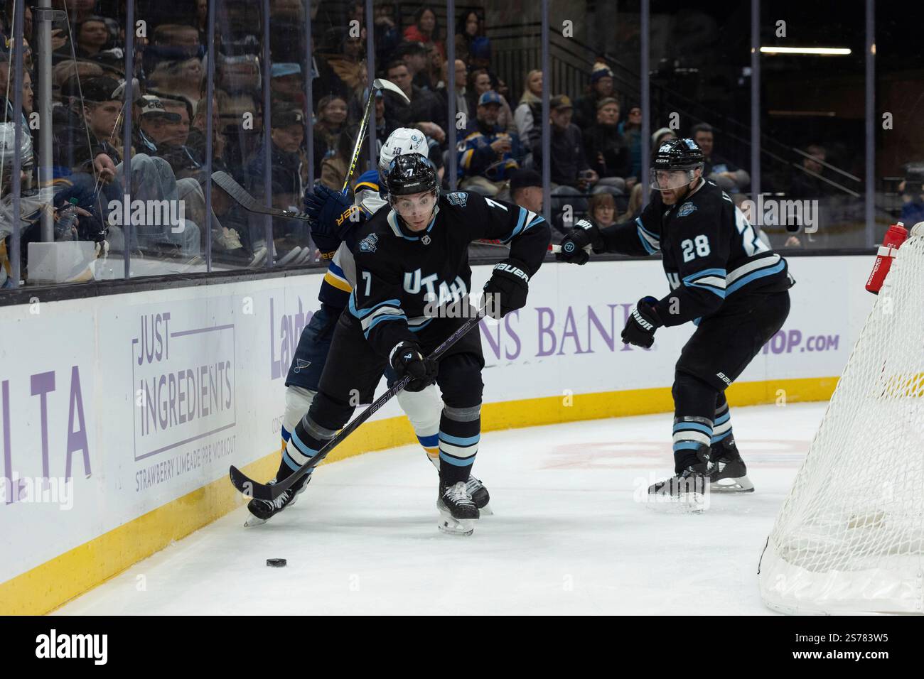 Utah Hockey Club defenseman Michael Kesselring (7) moves the puck ...
