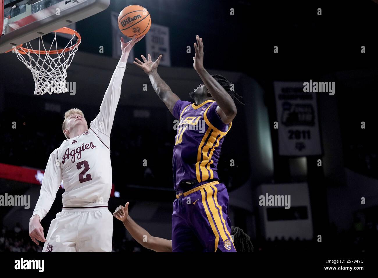 Texas A&M guard Hayden Hefner (2) grabs a rebound away from LSU forward ...