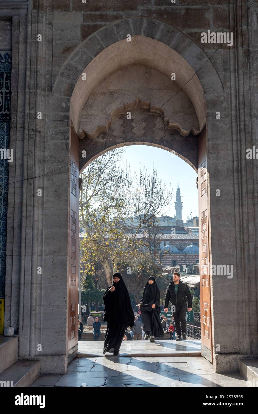 Istanbul, Turkey. 10th Jan, 2025. Muslim women entering the arched door ...
