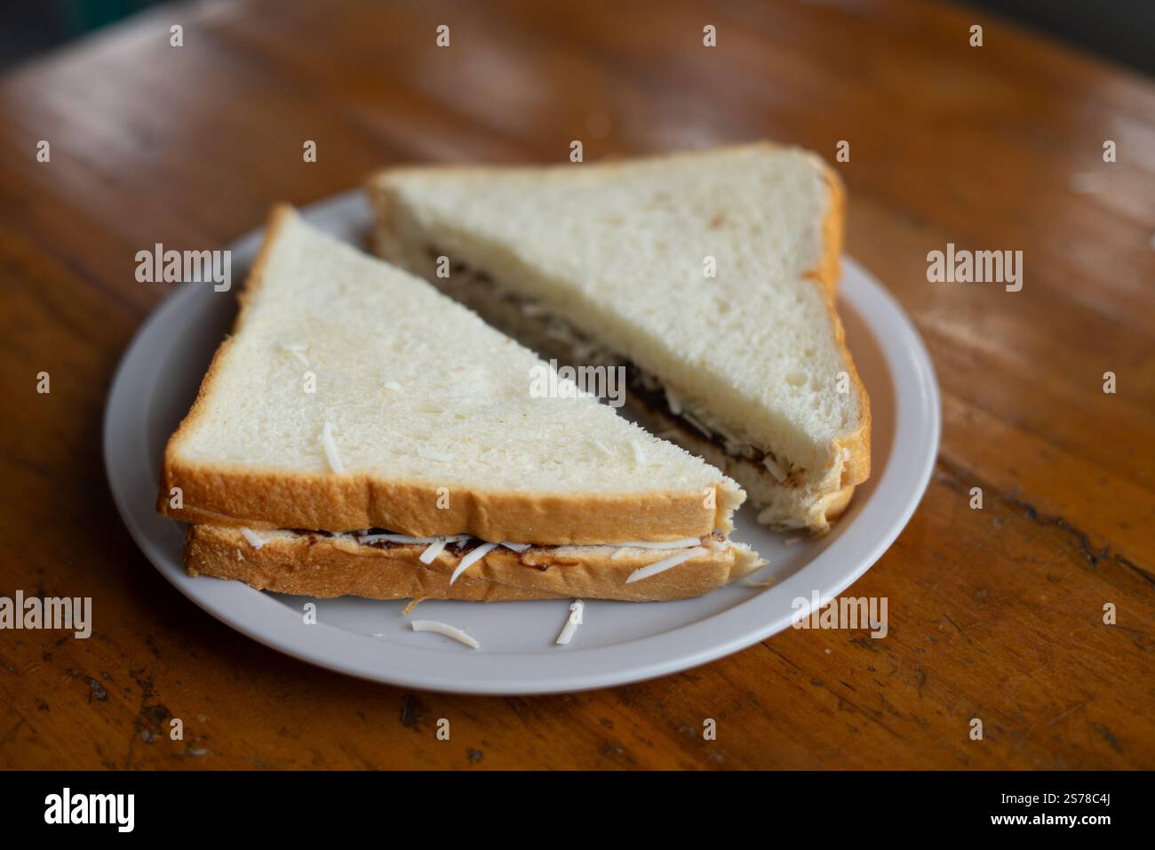 A cut chocolate crunch sandwich on a plate, ready to be enjoyed Stock ...