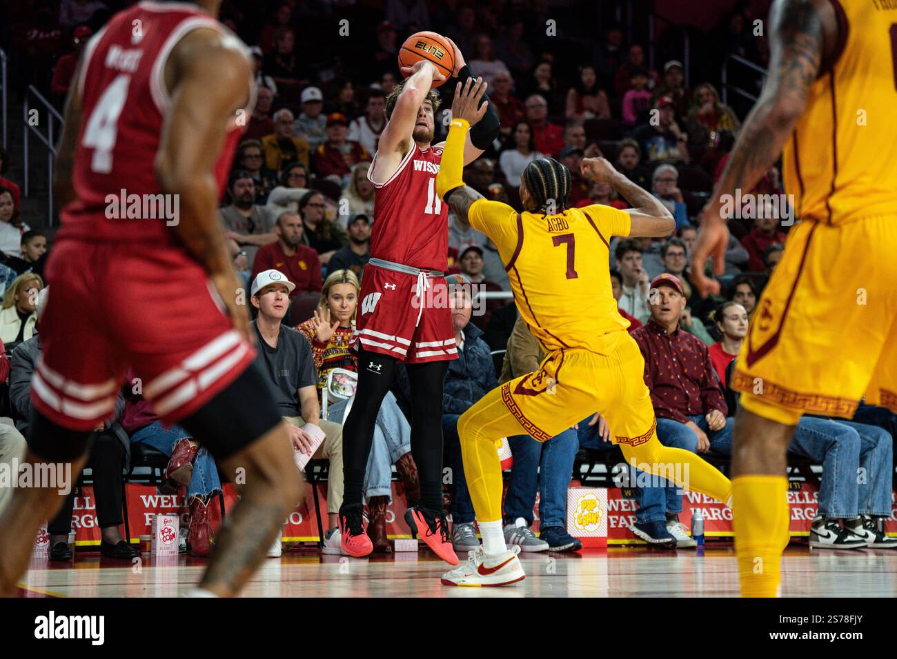 Wisconsin Badgers guard Max Klesmit (11) shoots over USC Trojans guard ...