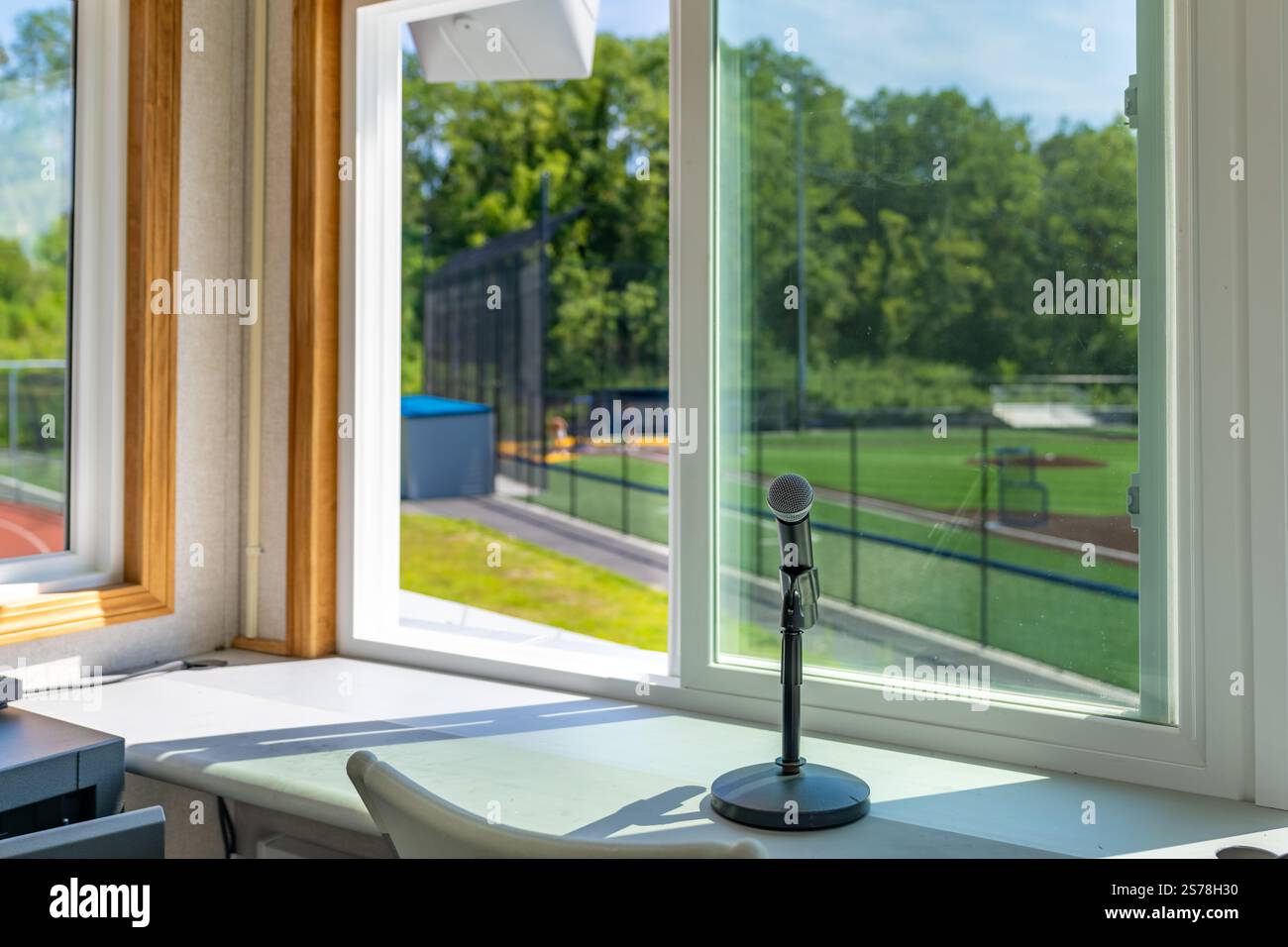 Interior of a press box with a microphone with a few of a synthetic ...