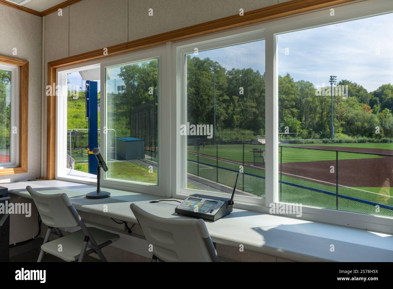 Interior of a press box with a microphone with a few of a synthetic ...