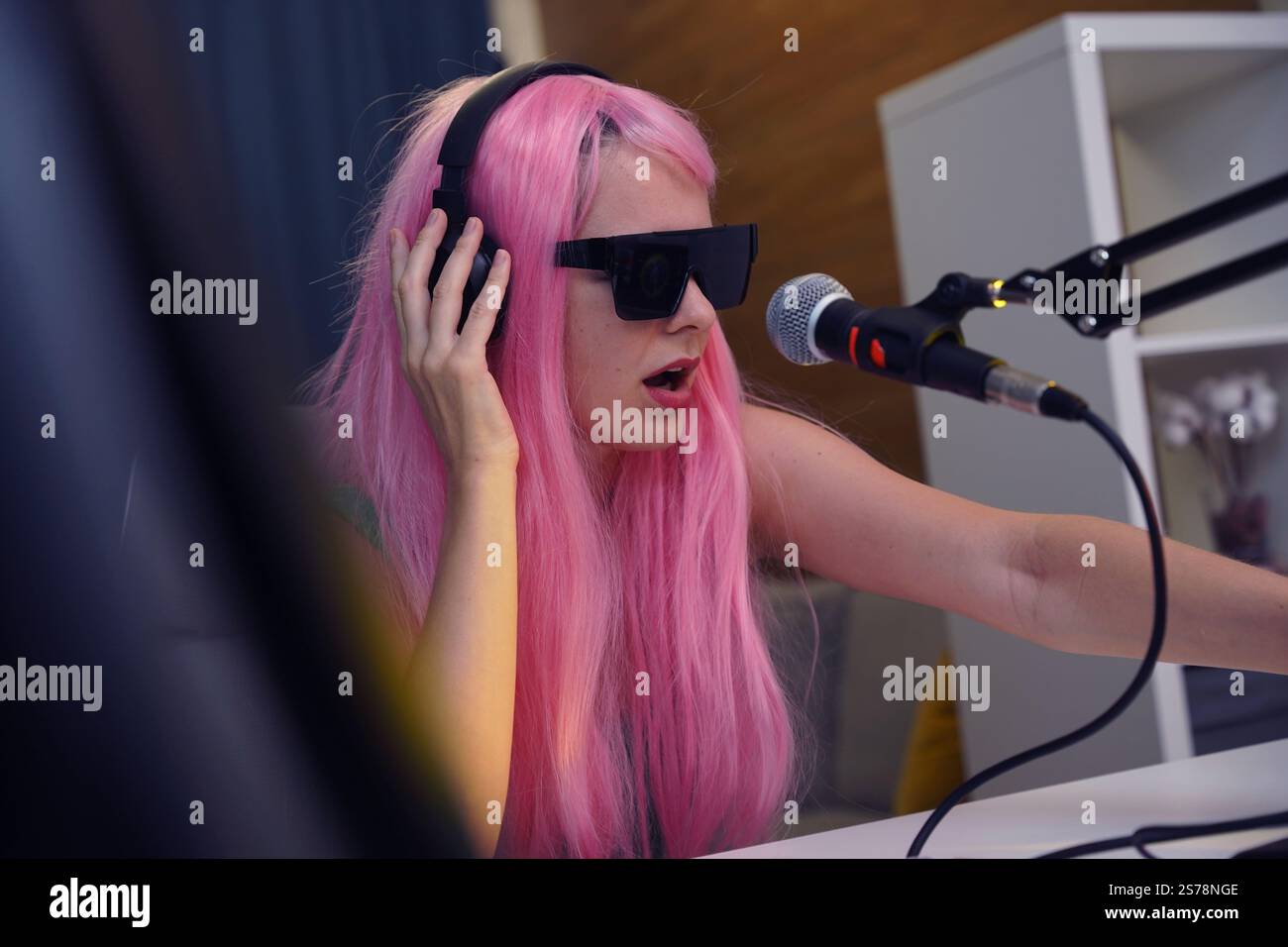 Beautiful young singer and musician broadcast from her home studio ...